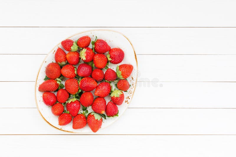 Fresh Strawberries in Plate on White Wooden Table. Top View Stock Image ...