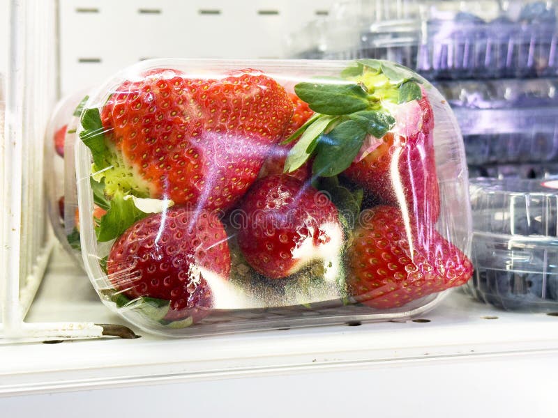 Fresh Strawberries in Transparent Plastic Pack on Supermarket Shelf ...