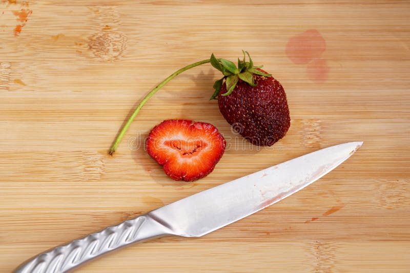Fresh Strawberry Cut on a Chopping Board Stock Photo - Image of green ...