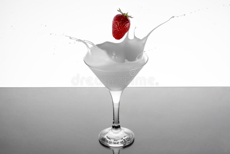 Fresh Strawberry Falling into Glass of Milk Stock Image - Image of ...