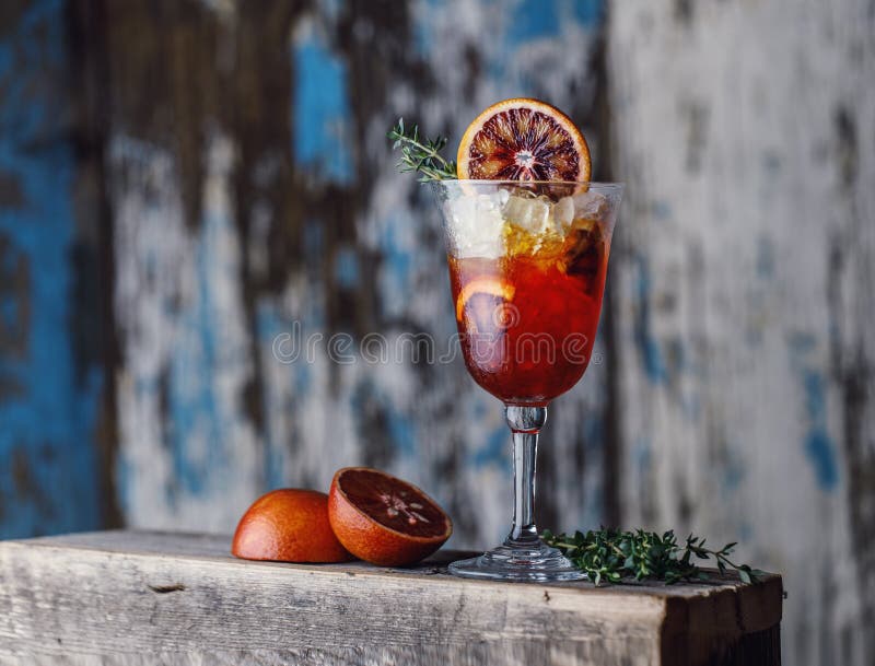 Fresh Summer Cocktail with Red Oranges in a Glass on Rustic Background ...