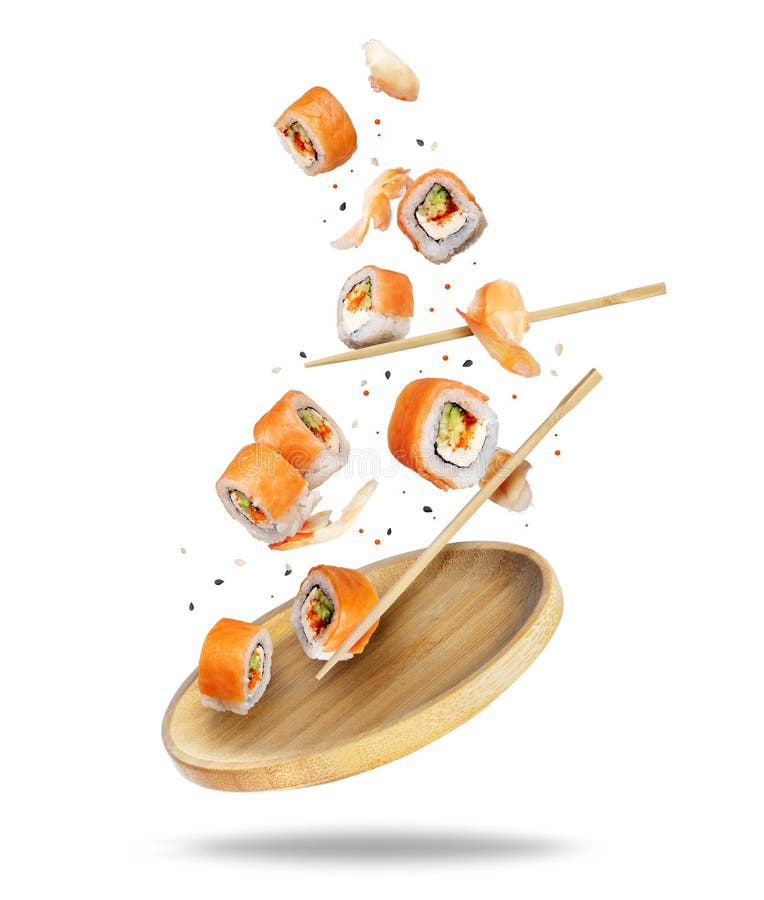 Fresh Sushi Rolls with Ginger Falling on a Wooden Plate Stock Image ...
