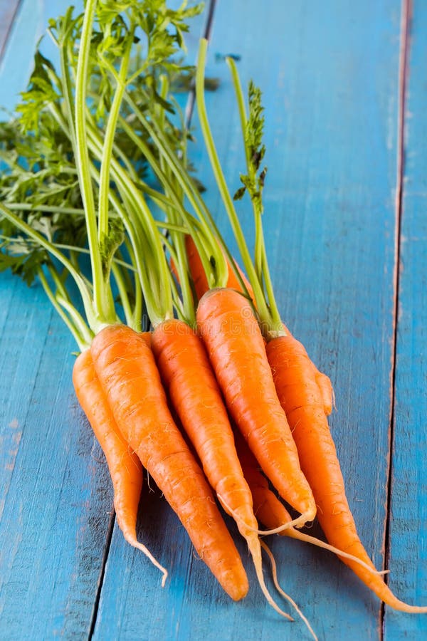 Fresh and Sweet Carrot on a Grey Wooden Table Stock Photo - Image of ...