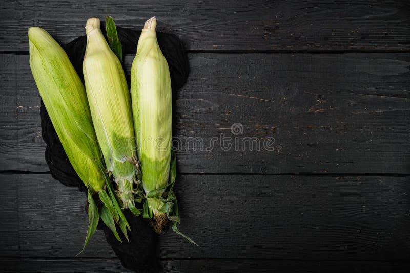 Fresh Sweet Corn Cobs, on Black Dark Stone Table Background, Top View ...