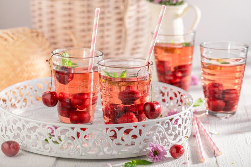 Fresh and Sweet Lemonade with Cherries and Crushed Ice Stock Photo ...