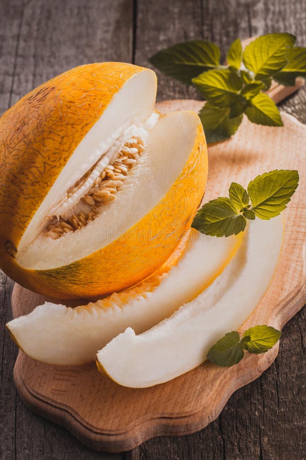 Fresh Sweet Orange Melon on the Wooden Table Stock Photo - Image of ...