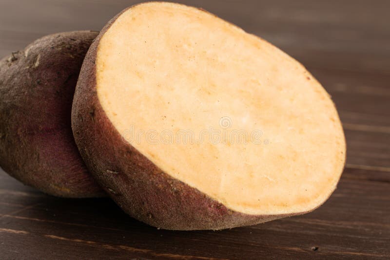 Fresh Sweet Potato on Brown Wood Stock Photo - Image of firm, root ...