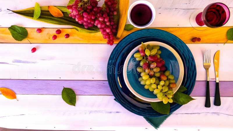 Fresh Table Setting with Grapes and Wine on a Wooden Surface Stock ...