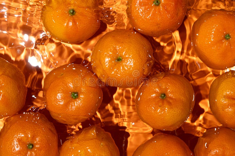 Fresh Tangerines Splashing into Clear Water Top View Stock Photo ...