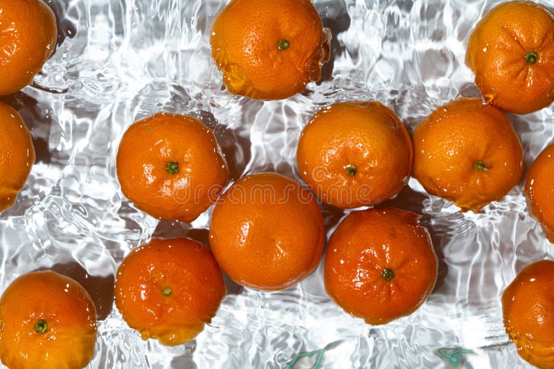 Fresh Tangerines Splashing into Clear Water Top View Stock Image ...