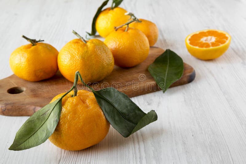 Fresh Tangerines on White Wooden Surface, Side View Stock Photo - Image ...