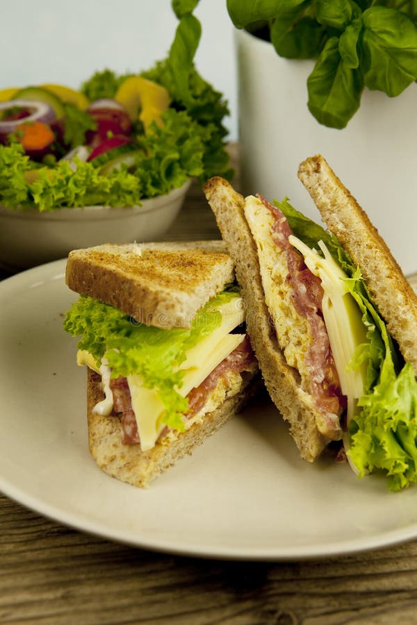 Fresh Tasty Club Sandwich with Cheese and Ham on Table Stock Photo ...