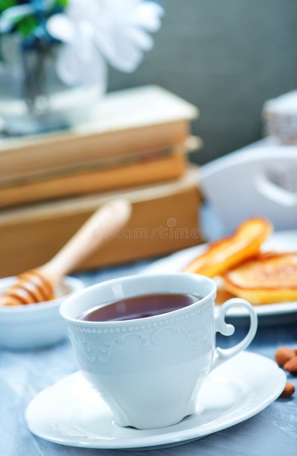 Fresh tea in cup stock photo. Image of plate, berries - 93547230