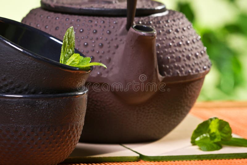 Fresh Tea Leaves and Kettle in the Garden Stock Image - Image of mamboo ...