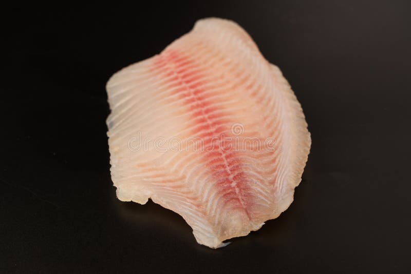 Fresh Tilapia Fillet on Black Background, Top View Stock Image - Image ...