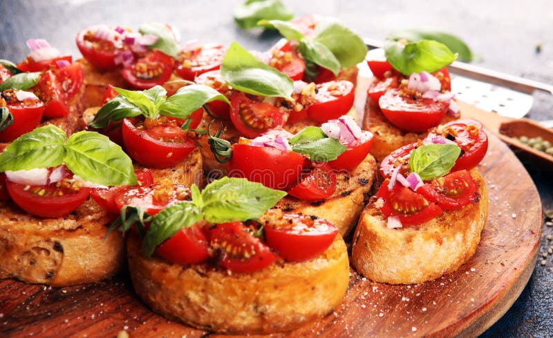 Fresh Tomato Bruschetta. Italian Food Appetizer with Basil on Table ...