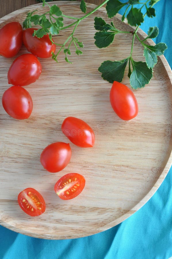 Tomato on circle wood. stock image. Image of tasty, energy - 145640615
