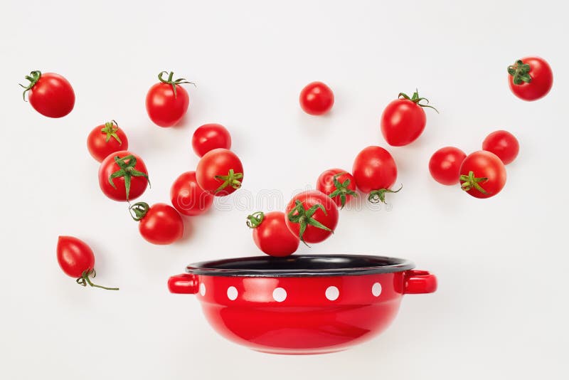 Fresh Tomato Falling into Red Pot Stock Photo - Image of explosion ...