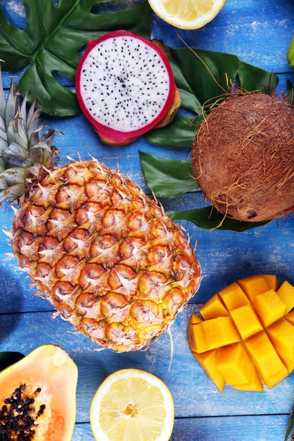 Fresh Tropical Fruits on the Beach with a Palm Leave. Assorted Tropical ...