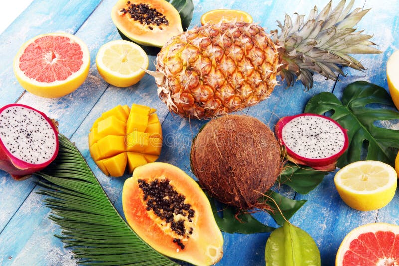 Fresh Tropical Fruits on the Beach with a Palm Leave. Assorted Tropical ...