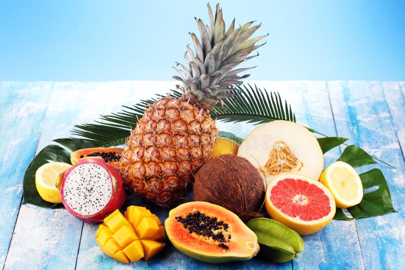 Fresh Tropical Fruits on the Beach with a Palm Leave. Assorted Tropical ...