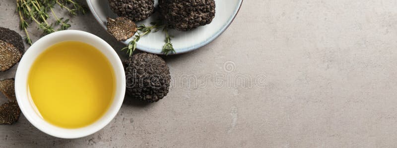 Fresh Truffles, Oil in Bowl and Thyme on Light Grey Table, Flat Lay ...