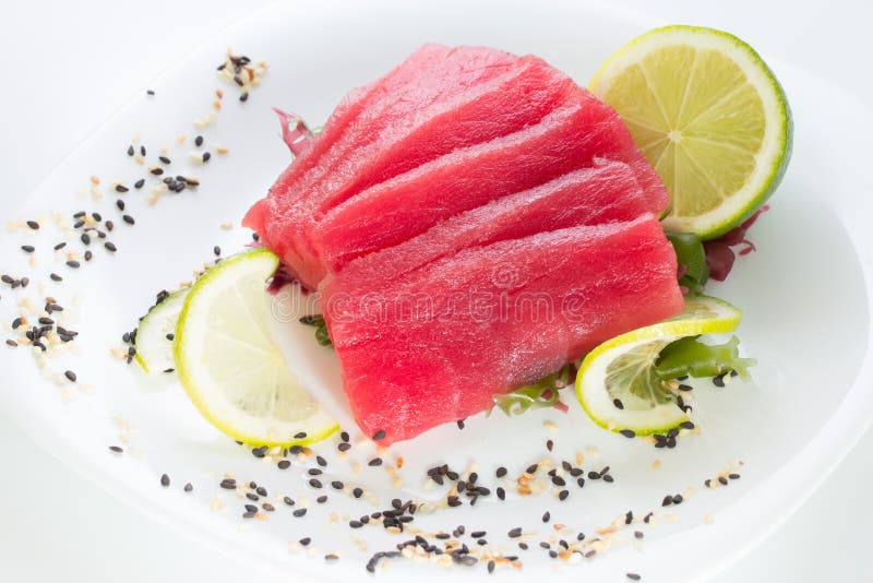 Fresh Raw Tuna Fish Pieces on Plate Isolated Stock Image - Image of ...