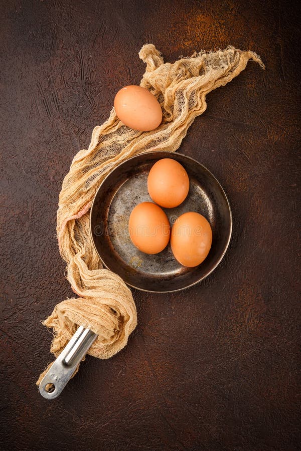 Fresh Uncooked Egg on a Pan, Stone or Concrete Background Stock Photo ...