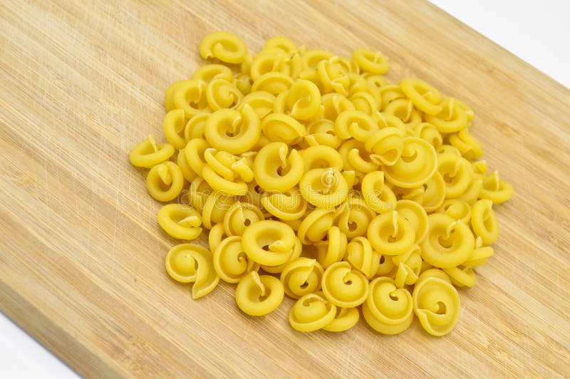Fresh Uncooked Gold Colored Pasta Stock Image - Image of farfalle ...