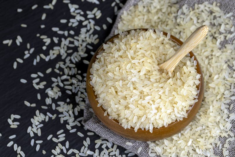 Fresh Uncooked Rice in Close-up Stock Photo - Image of thailand, yellow ...