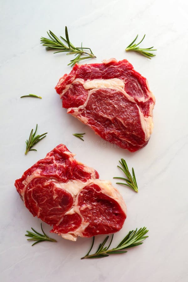 Fresh Uncooked Beef Steaks on Light Background Stock Image - Image of ...