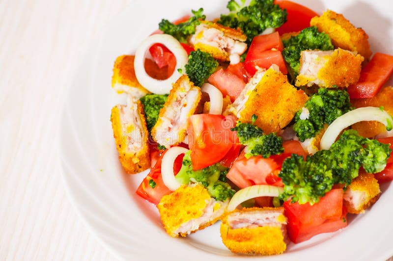 Fresh Vegetable Salad with Fried Breaded Fish Fillets Stock Image ...