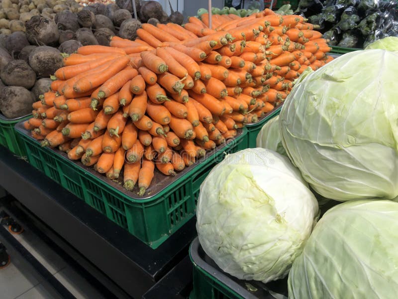 Fresh Vegetables, Carrot and Cabbage on Shelves in Supermarket Stock ...