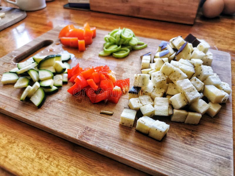 Fresh Vegetables Cut for Cooking on a Bamboo Chopping Board Stock Photo ...