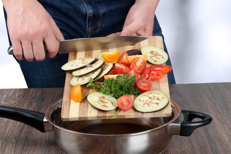 Fresh Vegetables on the Cutting Board are Falling in the Pan. Concept ...