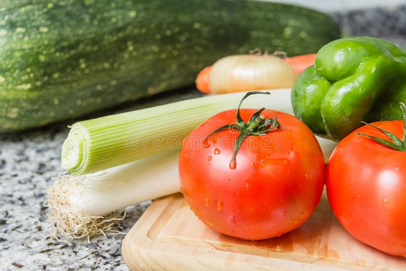 Fresh Vegetables on Cutting Board in the Kitchen Stock Photo - Image of ...