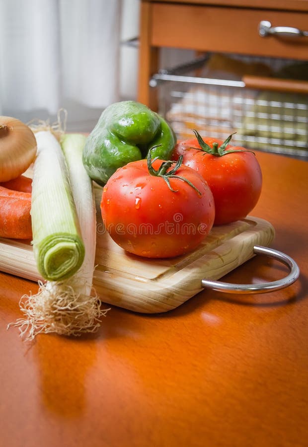 Fresh Vegetables on Cutting Board in the Kitchen Stock Photo - Image of ...