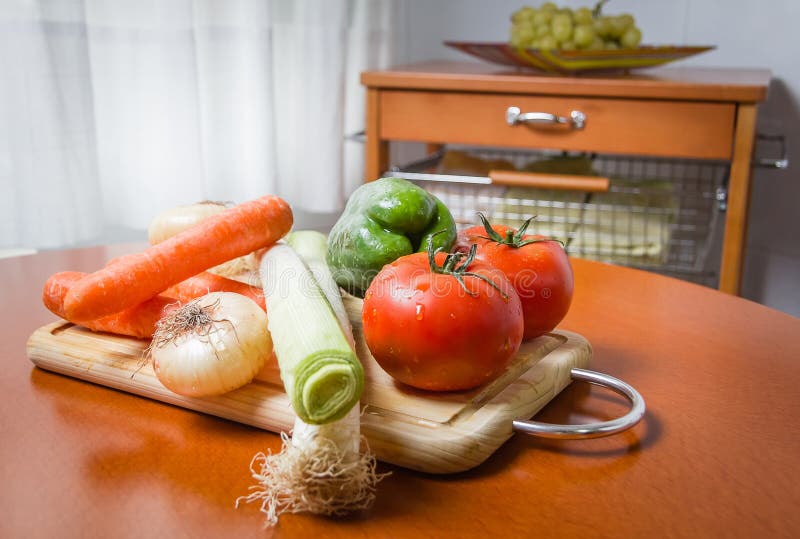 Fresh Vegetables on Cutting Board in the Kitchen Stock Photo - Image of ...