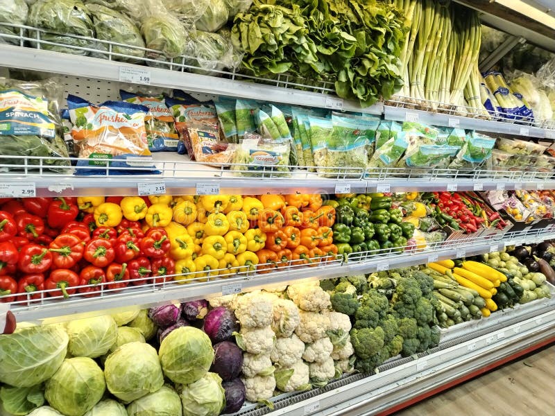 Fresh Vegetables on Display at a Busy Market Stall Stock Photo - Image ...