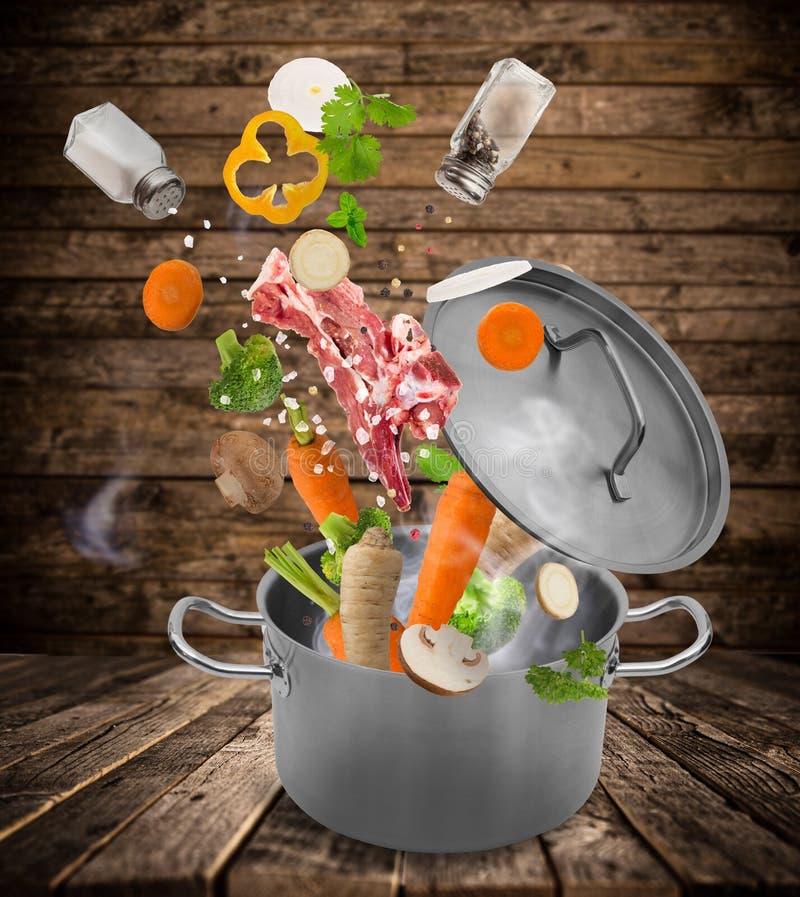 Vegetables Coming Out from a Stainless Steel Casserole Pot Stock Photo ...