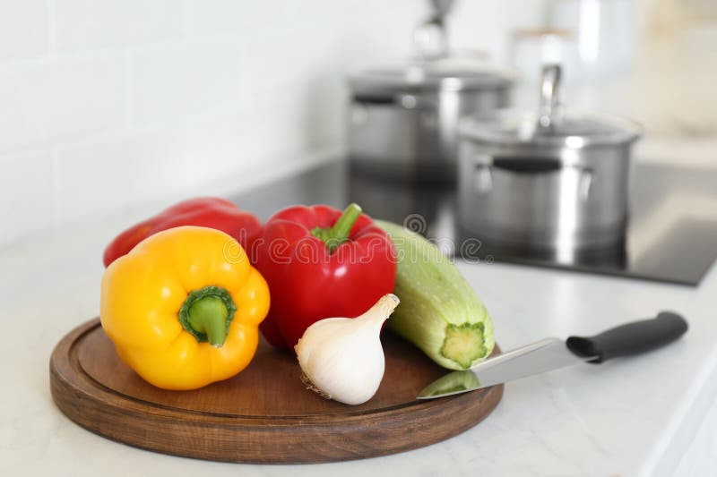 Fresh Vegetables and Knife on White Counter in Kitchen Stock Image ...