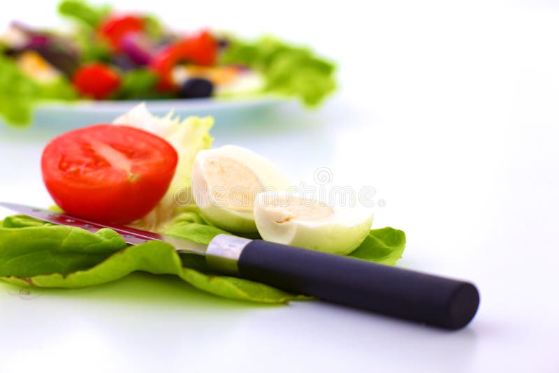 Fresh Vegetables with a Knife on the Table for Salad Preparation Stock ...