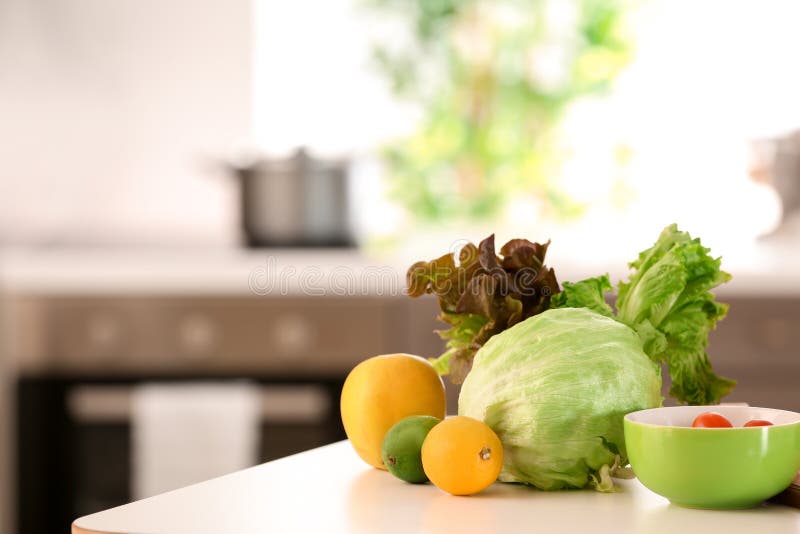 Fresh Vegetables on Table in Kitchen. Diet Food Concept Stock Photo ...