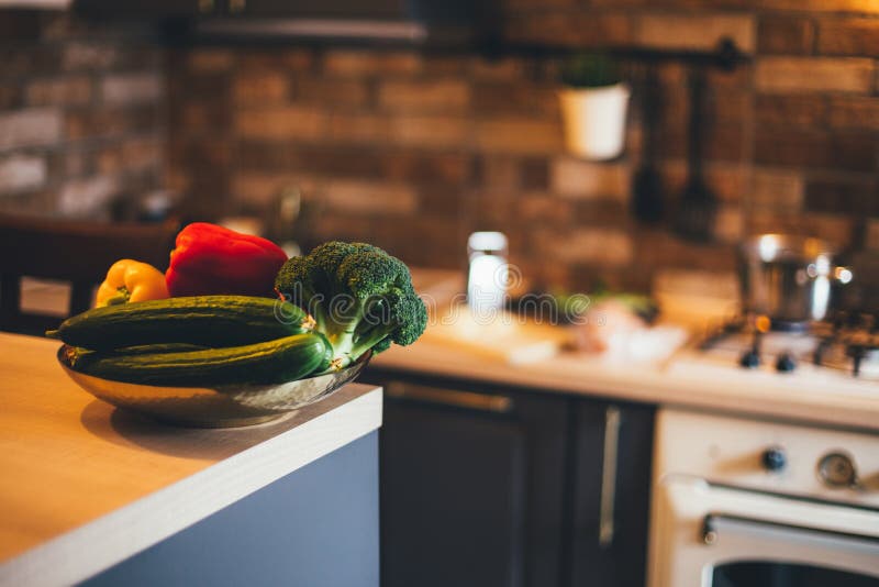 Fresh Vegetables on Table in Modern Kitchen. Stock Image - Image of ...