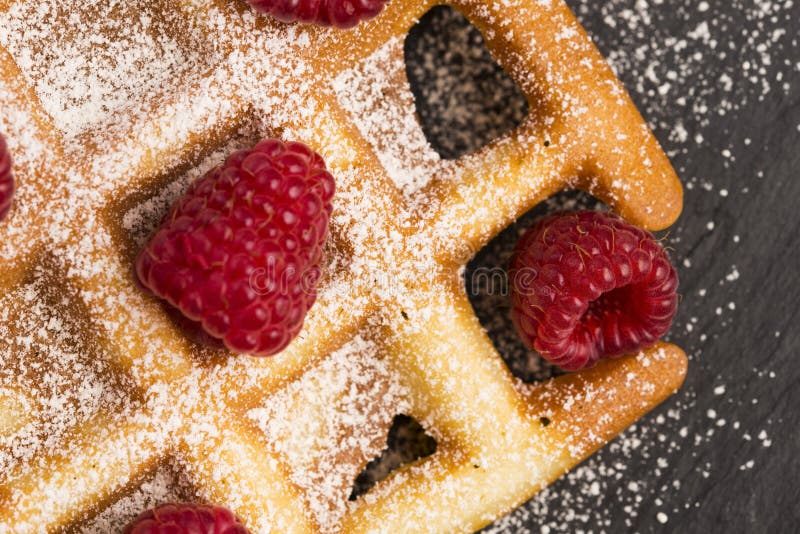 Fresh Waffles Garnished with Powdered Sugar and Raspberries Stock Image ...