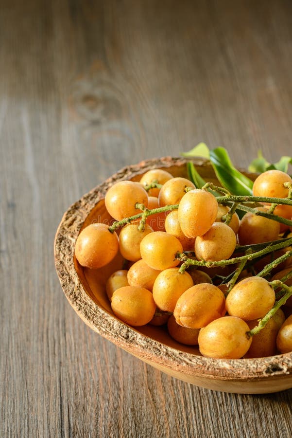 Fresh wampee fruit stock image. Image of board, wampi - 56207753