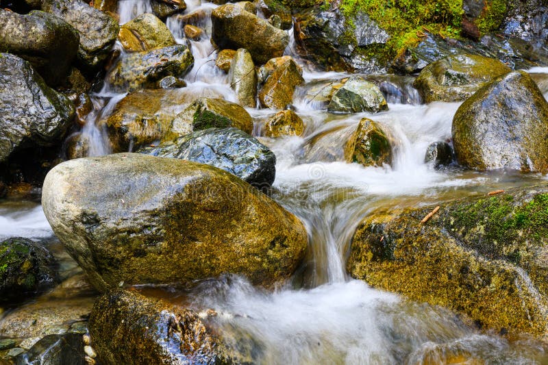 Fresh Water Stream Falling Over Smooth River Rocks in Mountain ...