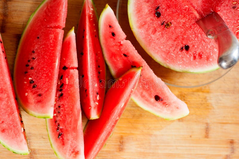 Fresh Watermelon on a Wood Table Stock Image - Image of striped ...