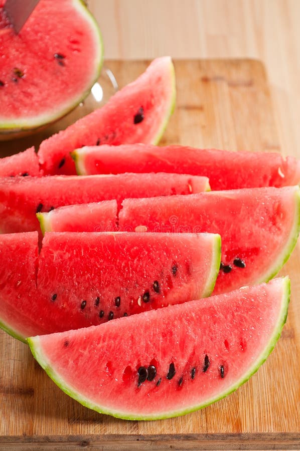 Fresh Watermelon on a Wood Table Stock Image - Image of striped, close ...