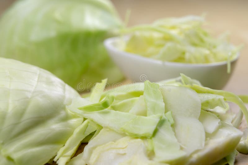 Fresh White Cabbage Cut into Strips on the Kitchen Table. Vegetables ...